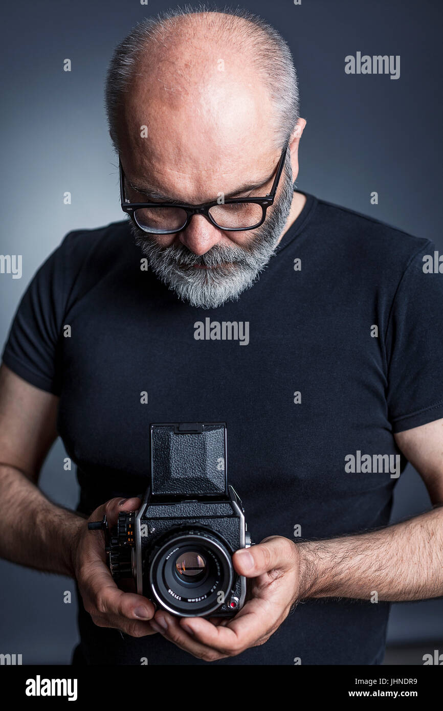 photographer with medium format film camera Stock Photo - Alamy