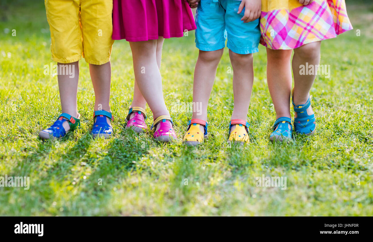 Footwear for children. Group of preschool kids wearing colorful leather ...