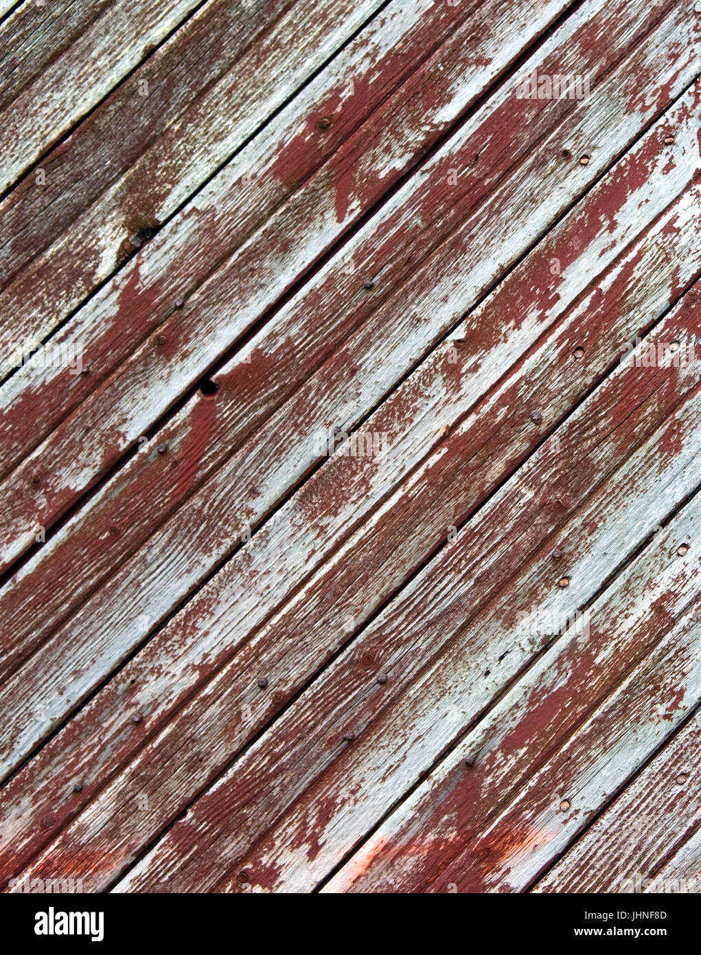 Weatheres patterns of worn paint on an old barn in Elmira, Prince ...