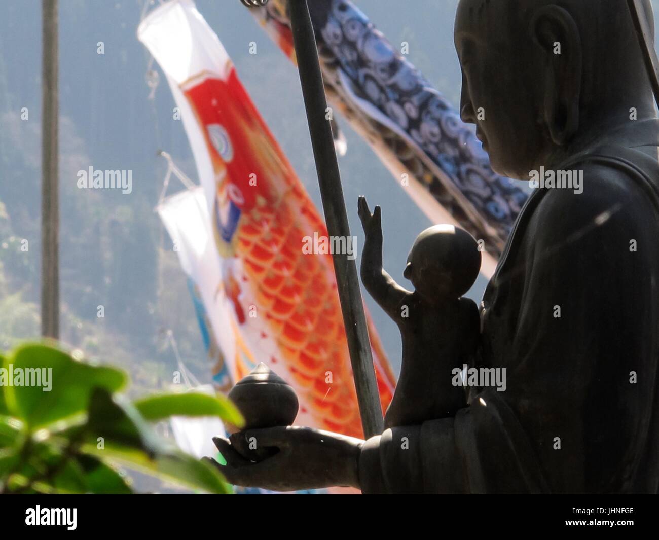 Japanese statue and fish flags Stock Photo - Alamy