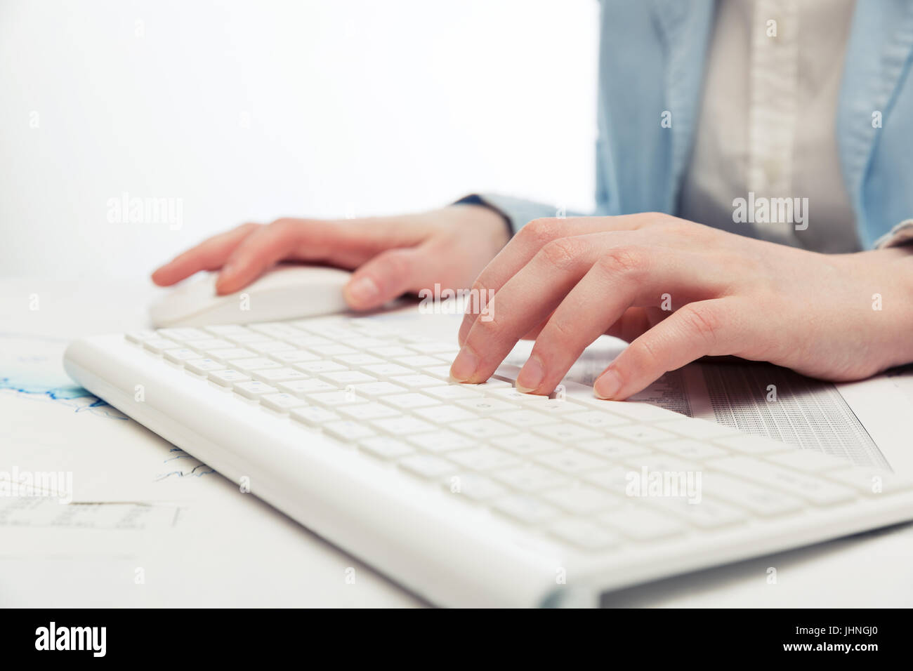 Business woman using computer mouse and keyboard Stock Photo - Alamy