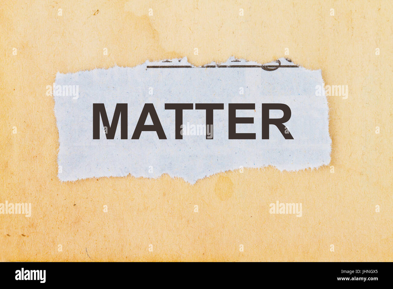 matter concept- newspaper cutout in an old paper background Stock Photo ...