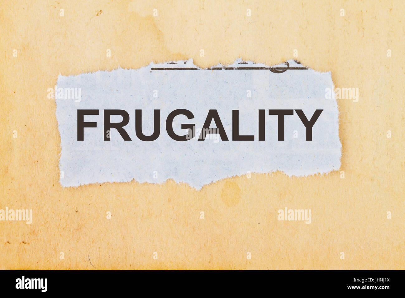 frugality newspaper cutout in an old paper background Stock Photo - Alamy