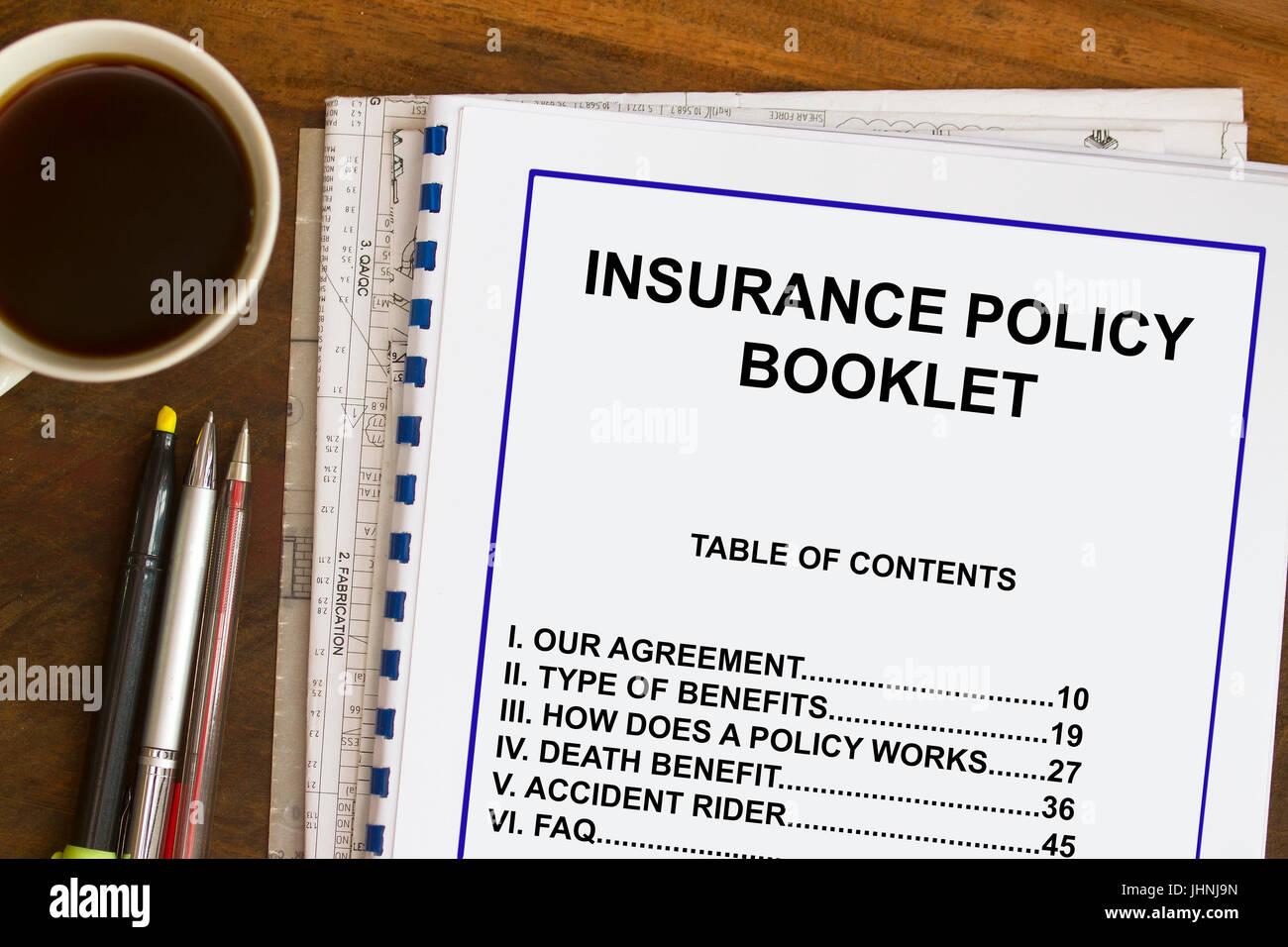 Insurance policy booklet with coffee and documents concept Stock Photo ...