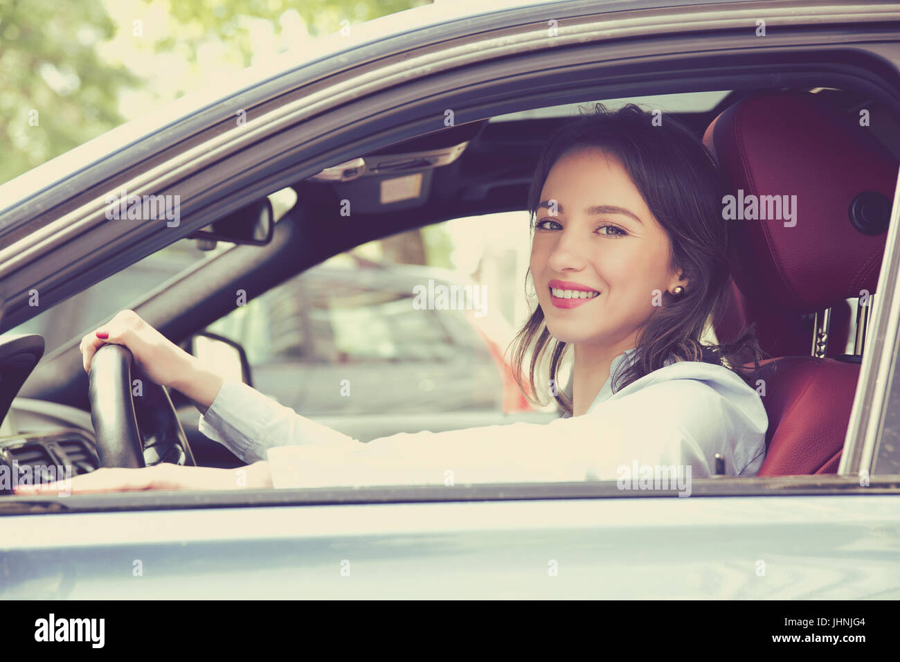 young happy woman driving a car Stock Photo - Alamy
