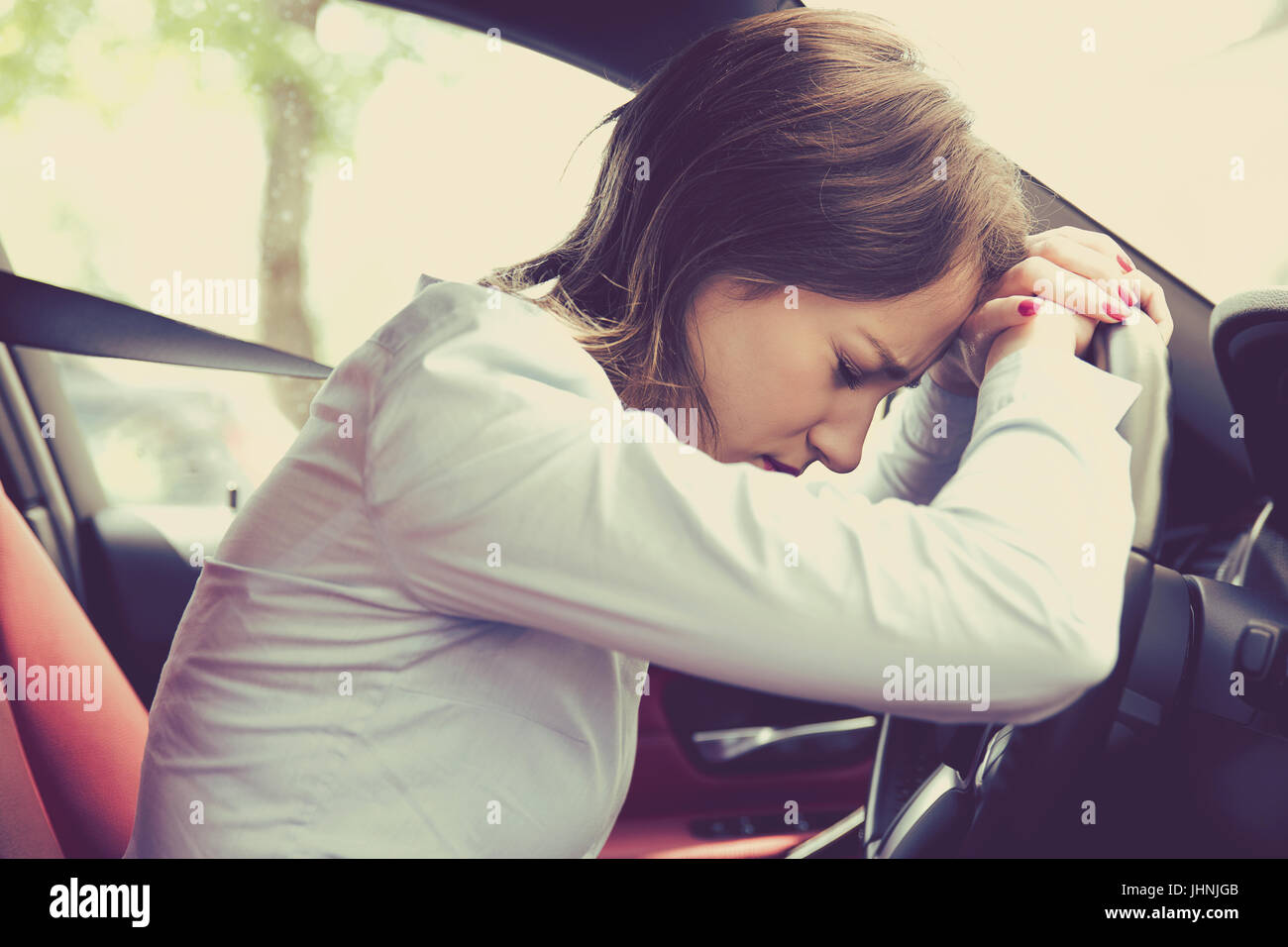 Stressed woman driver sitting inside her car Stock Photo - Alamy