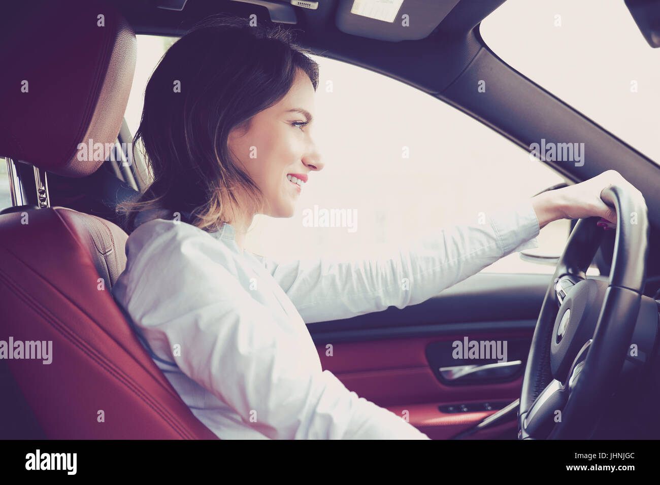 young woman driving a car Stock Photo - Alamy