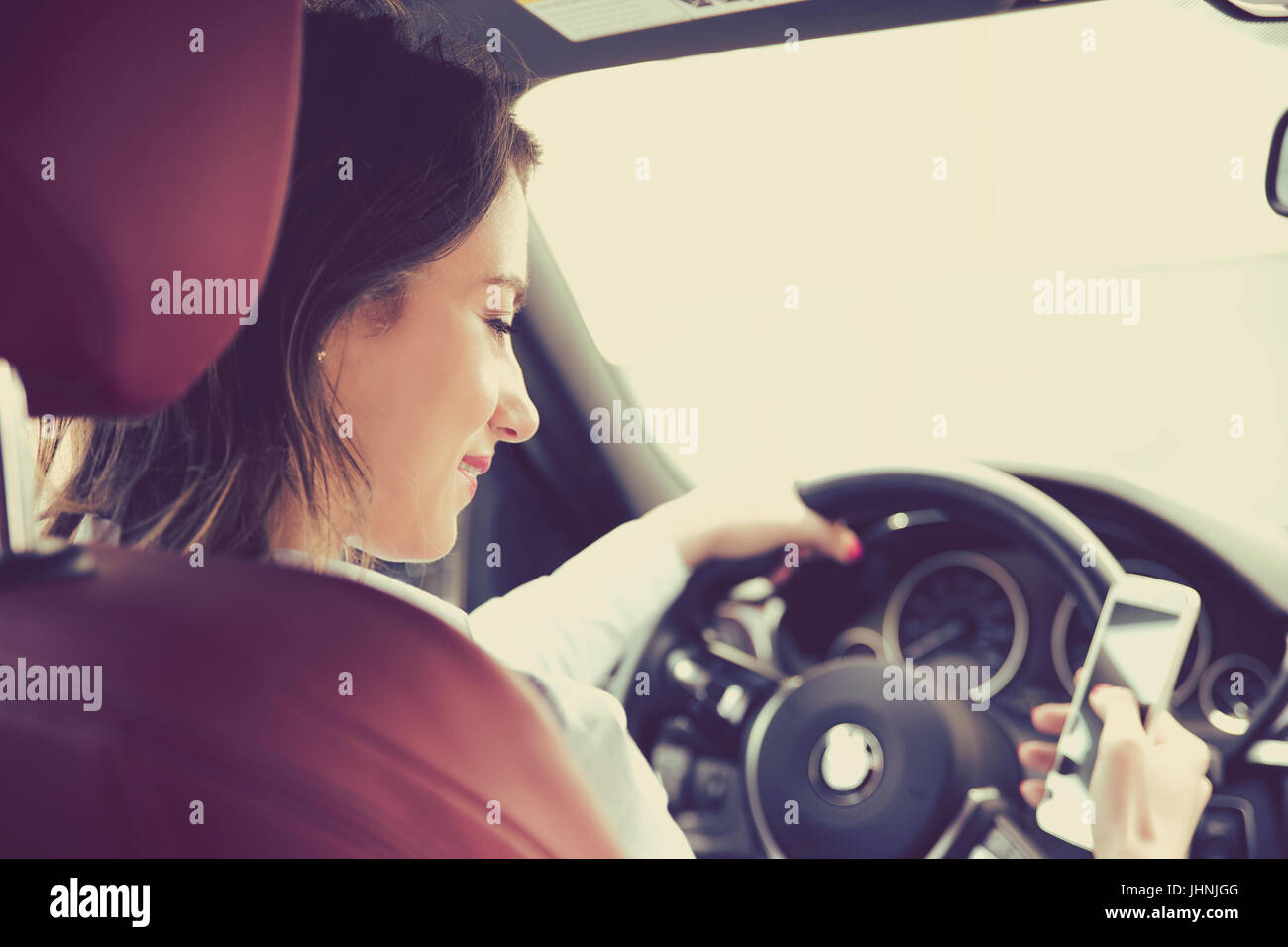 Girl driving with phone hi-res stock photography and images - Alamy
