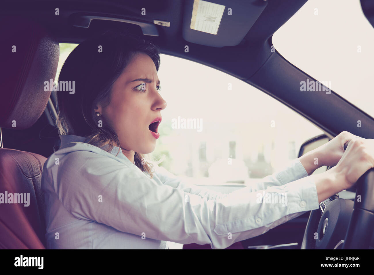 Angry woman driving car hi-res stock photography and images - Alamy