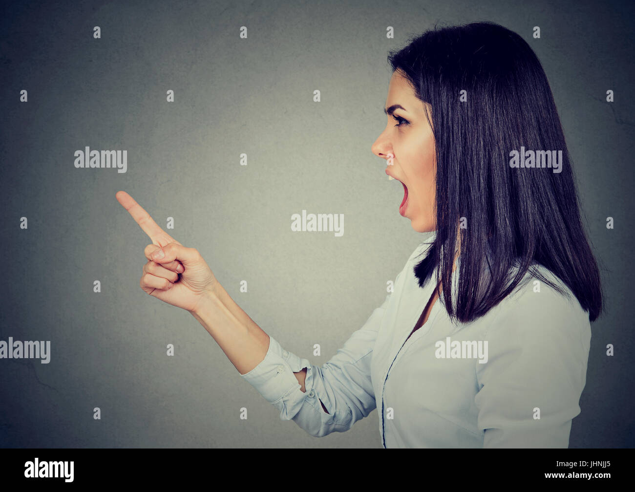 Side profile beautiful angry woman screaming Stock Photo - Alamy