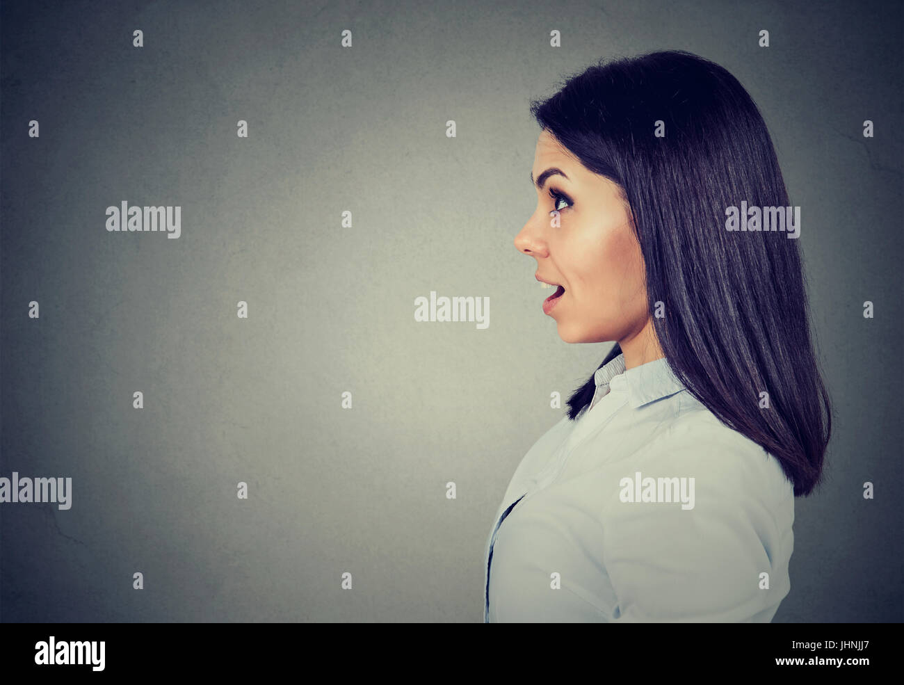 Side profile of a shocked woman Stock Photo - Alamy