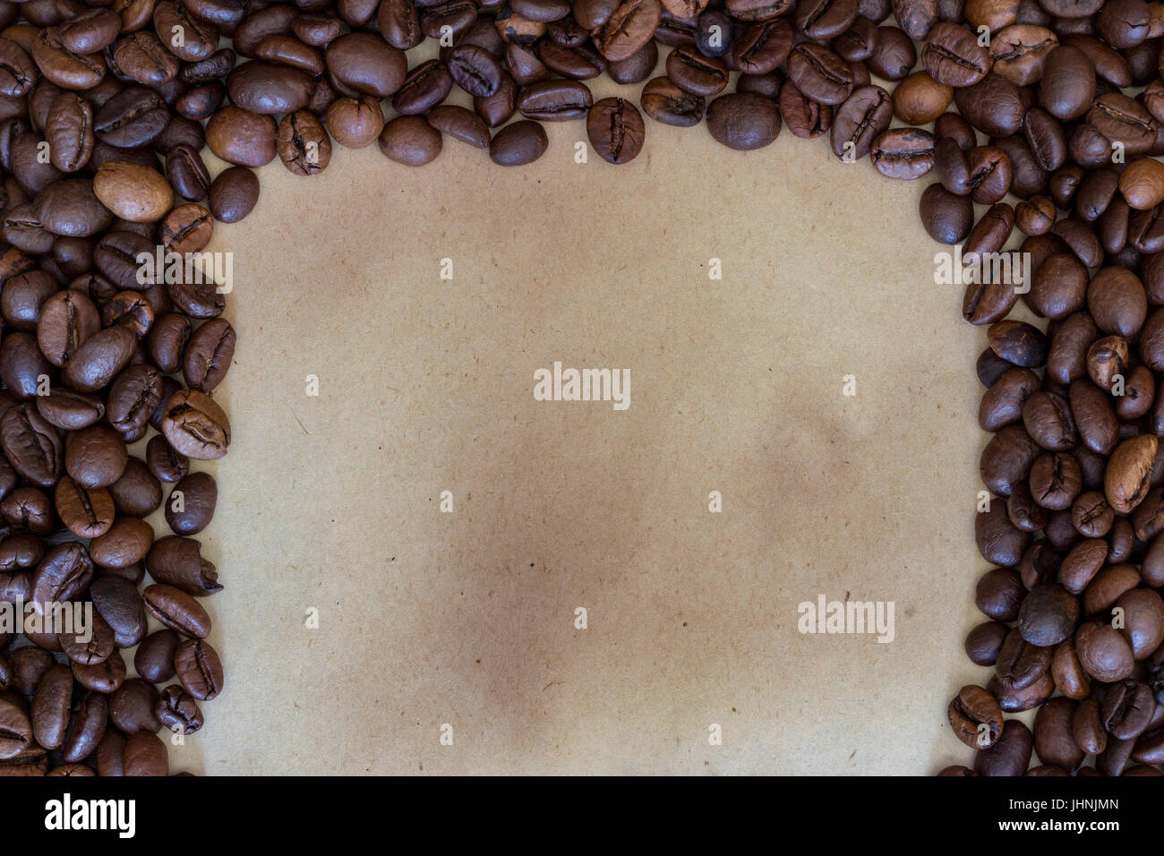 Coffee beans on a vintage paper Stock Photo - Alamy