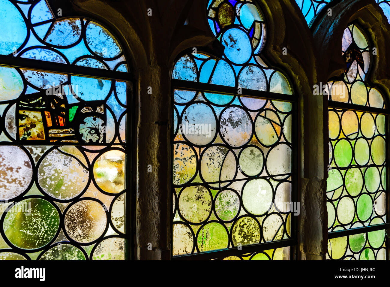 Old medieval colorful leaded-pane windows in gothic style, France ...