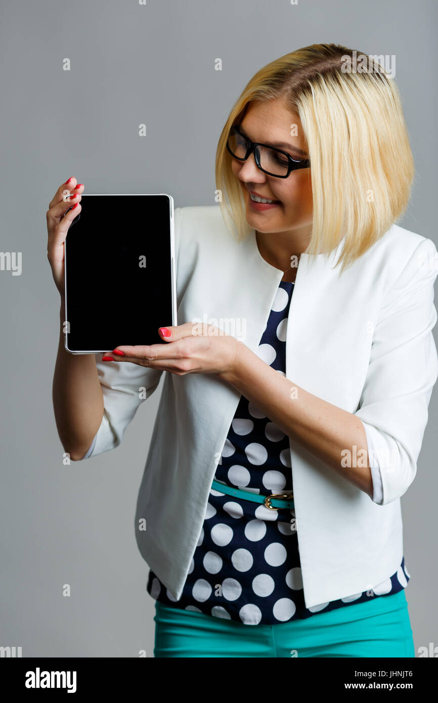 Girl on empty gray background Stock Photo - Alamy