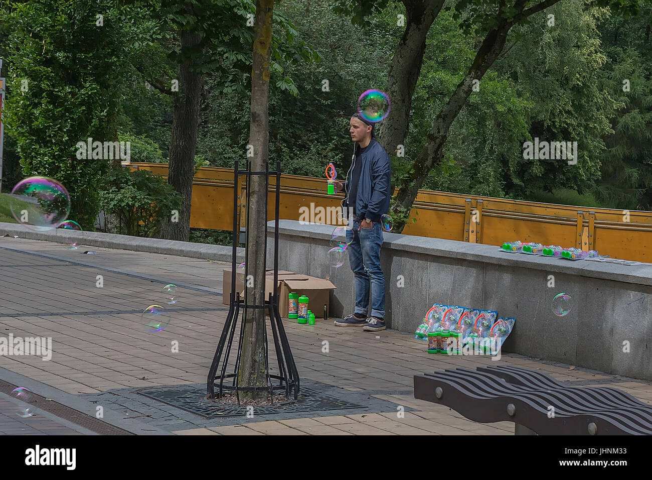 A young man sells soap bubbles Stock Photo - Alamy