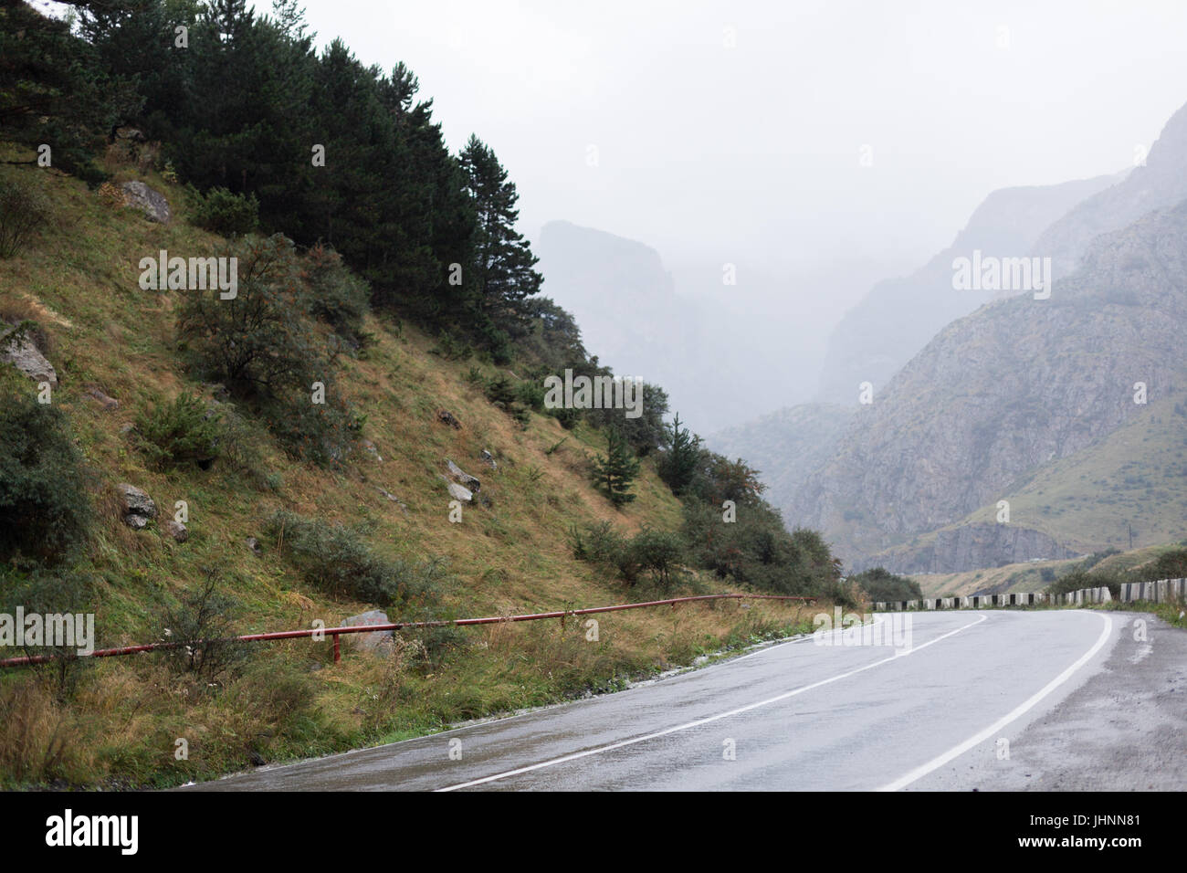 Cinematic road landscape. Asphalt Road throuth the mountains. With ...