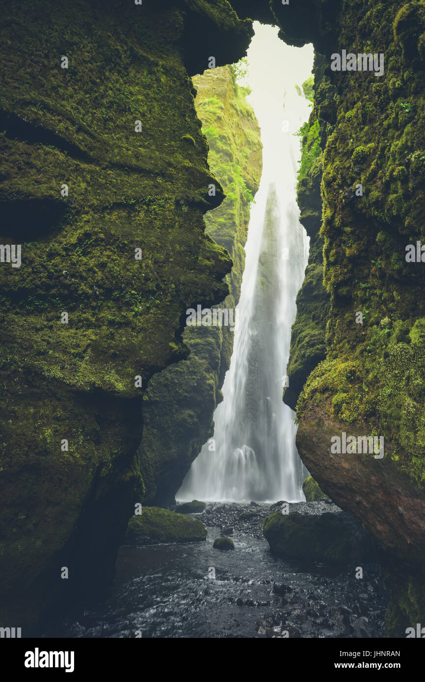 Gljufrabui waterfall (Iceland) hidden in cave in summer. Vintage effect ...