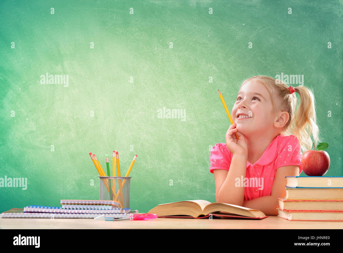 Little Student Thinking In Classroom Stock Photo - Alamy