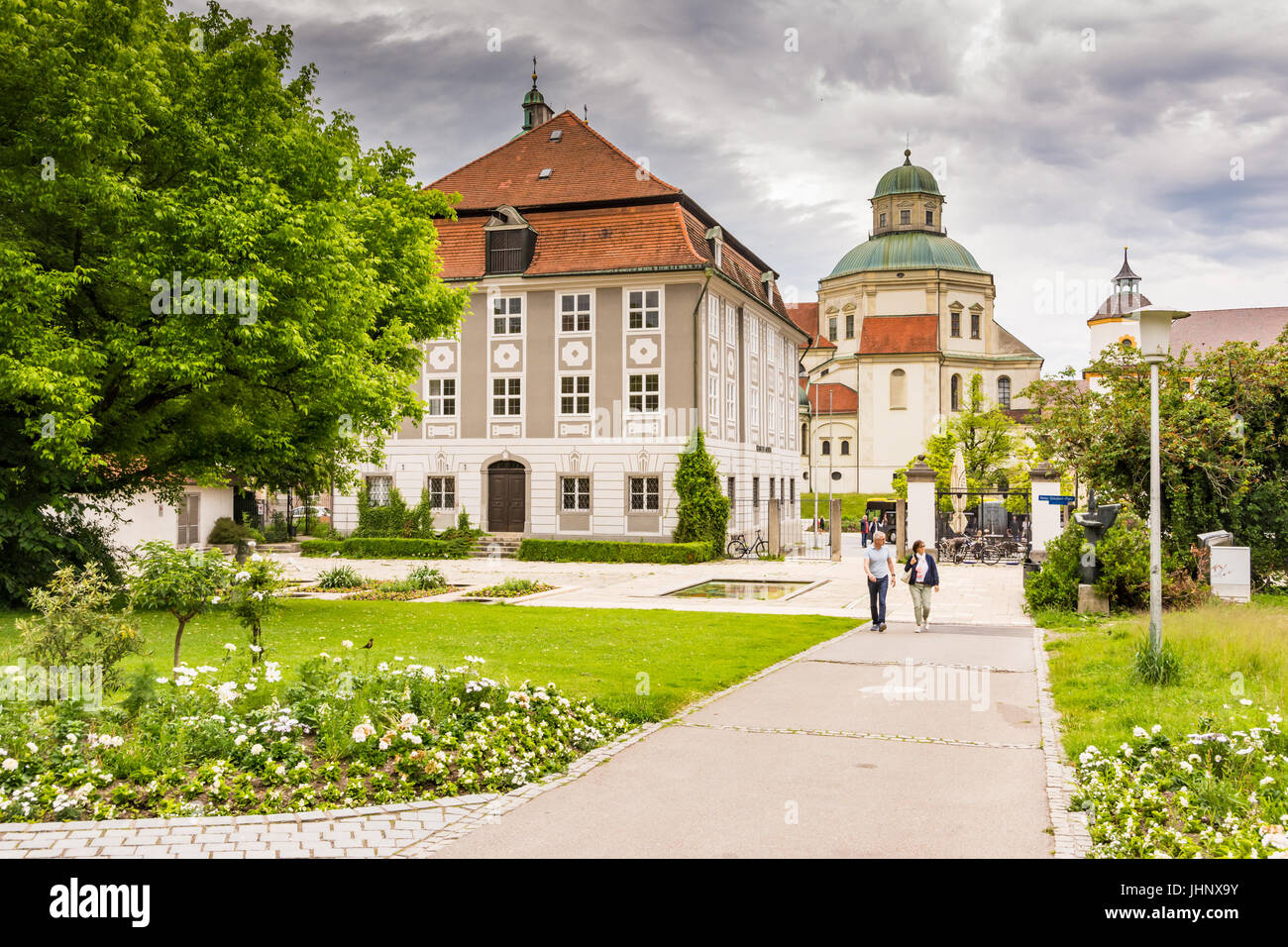 KEMPTEN, GERMANY - JUNE 9: People in park at the Basilica of Keptem ...