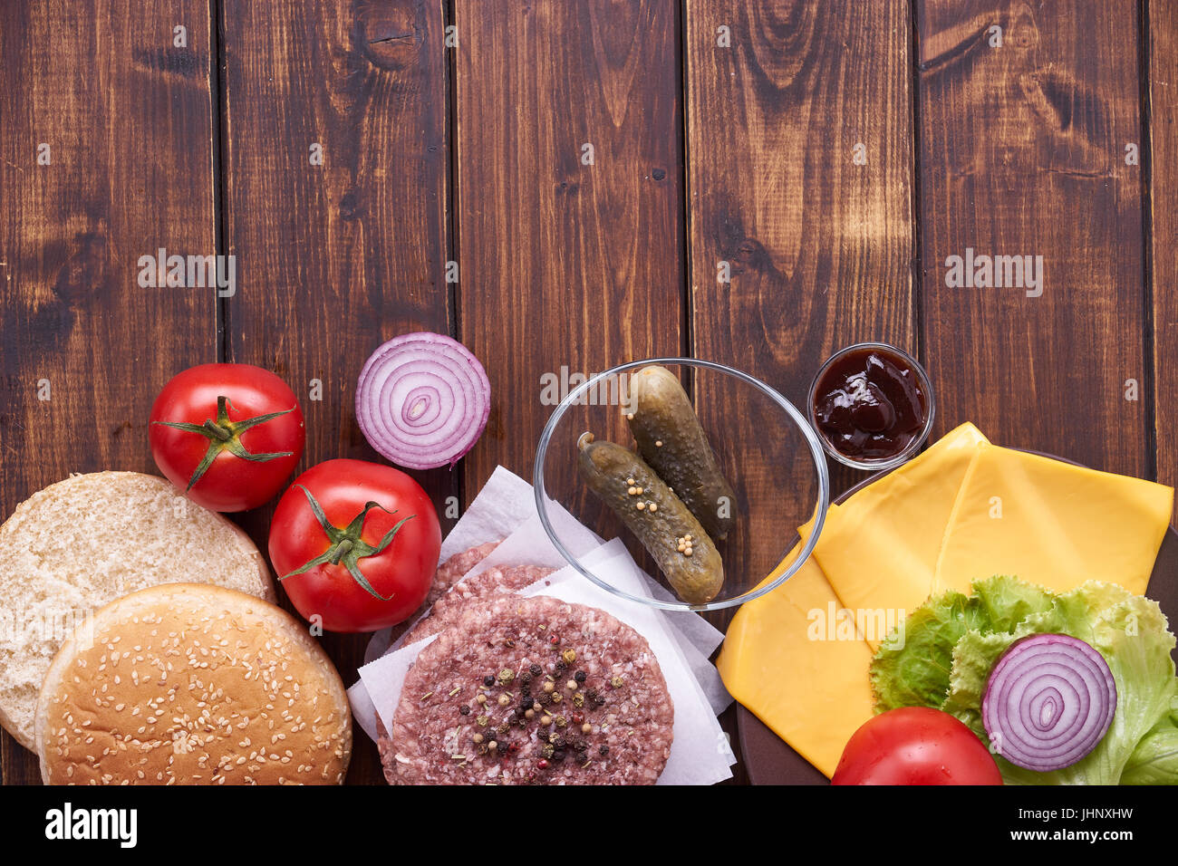 Top view of raw cheeseburger ingredients Stock Photo - Alamy
