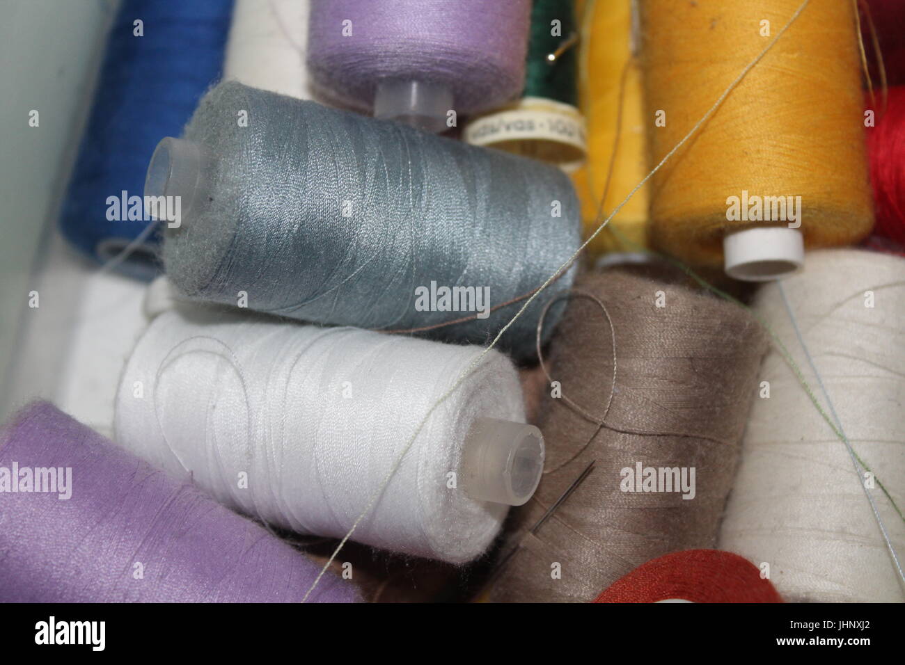 Pile of different sowing threads Stock Photo - Alamy