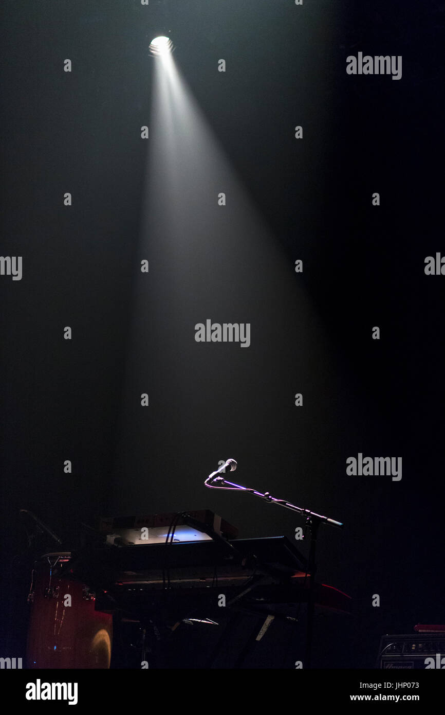 microphone on stage with spotlight light illumination Stock Photo - Alamy