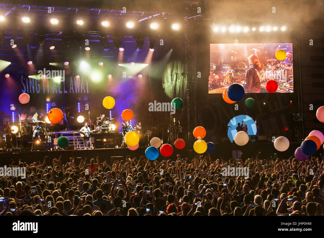 Montreal Jazz Festival, outdoor stage at night with a crowd of people ...