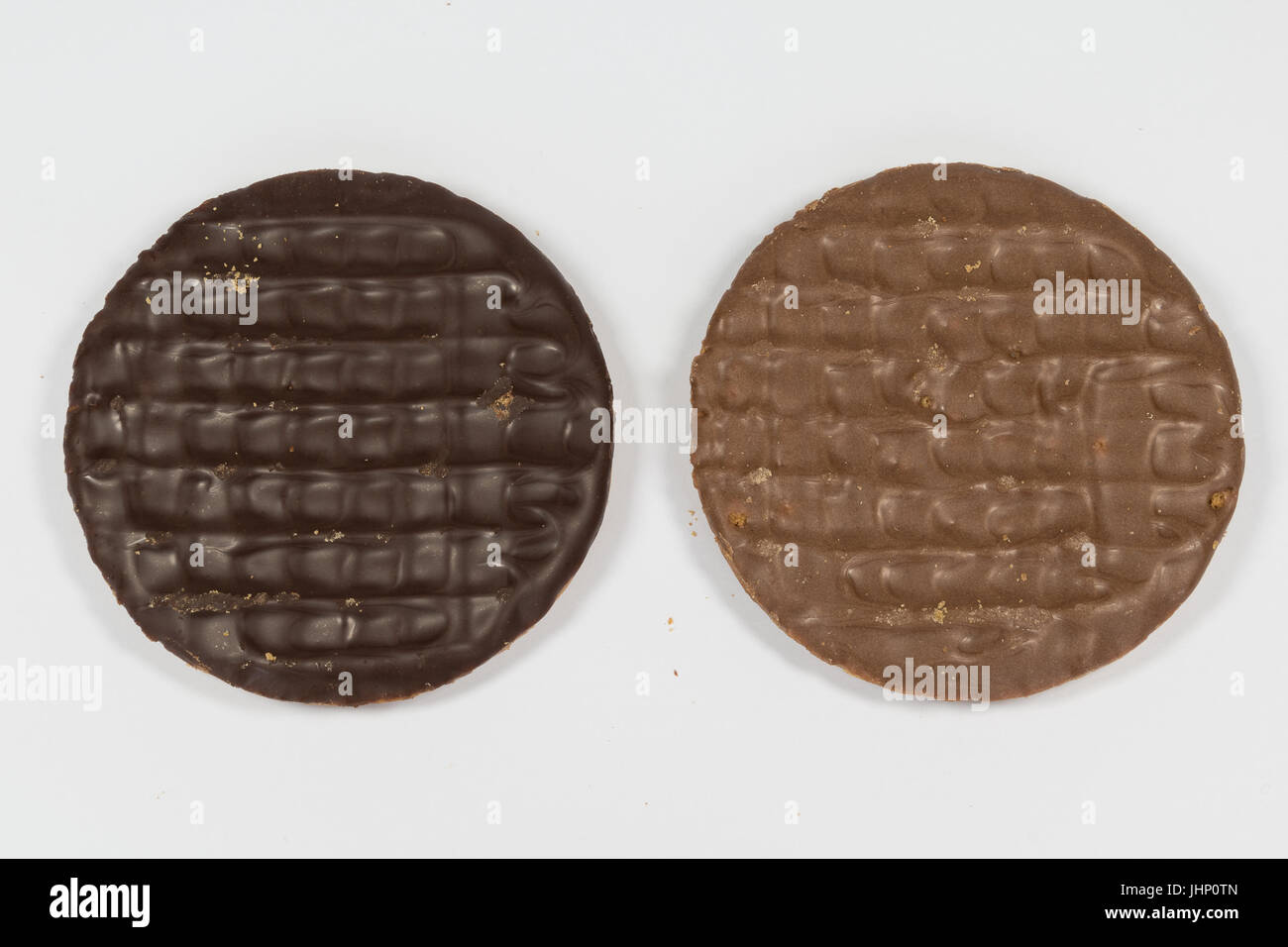 Milk and plain Chocolate digestive biscuits isolated on a white ...