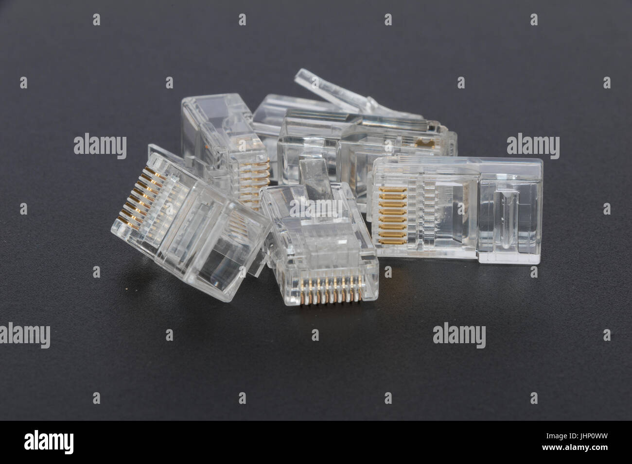 Blank RJ45 Ethernet plugs on a black background Stock Photo - Alamy