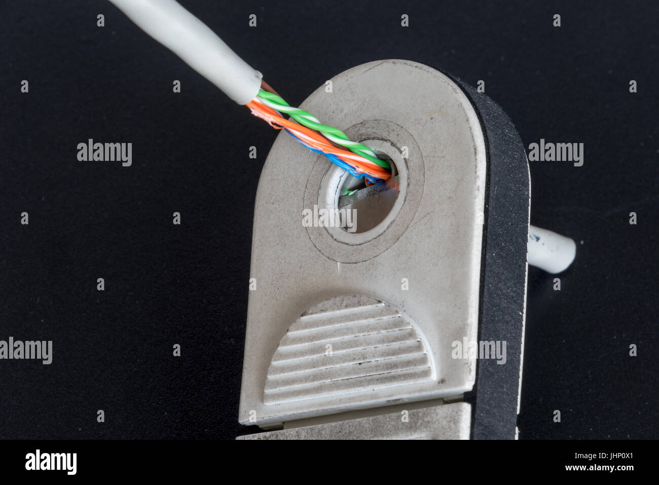 Stripping the outer sheaf from an ethernet cable Stock Photo - Alamy