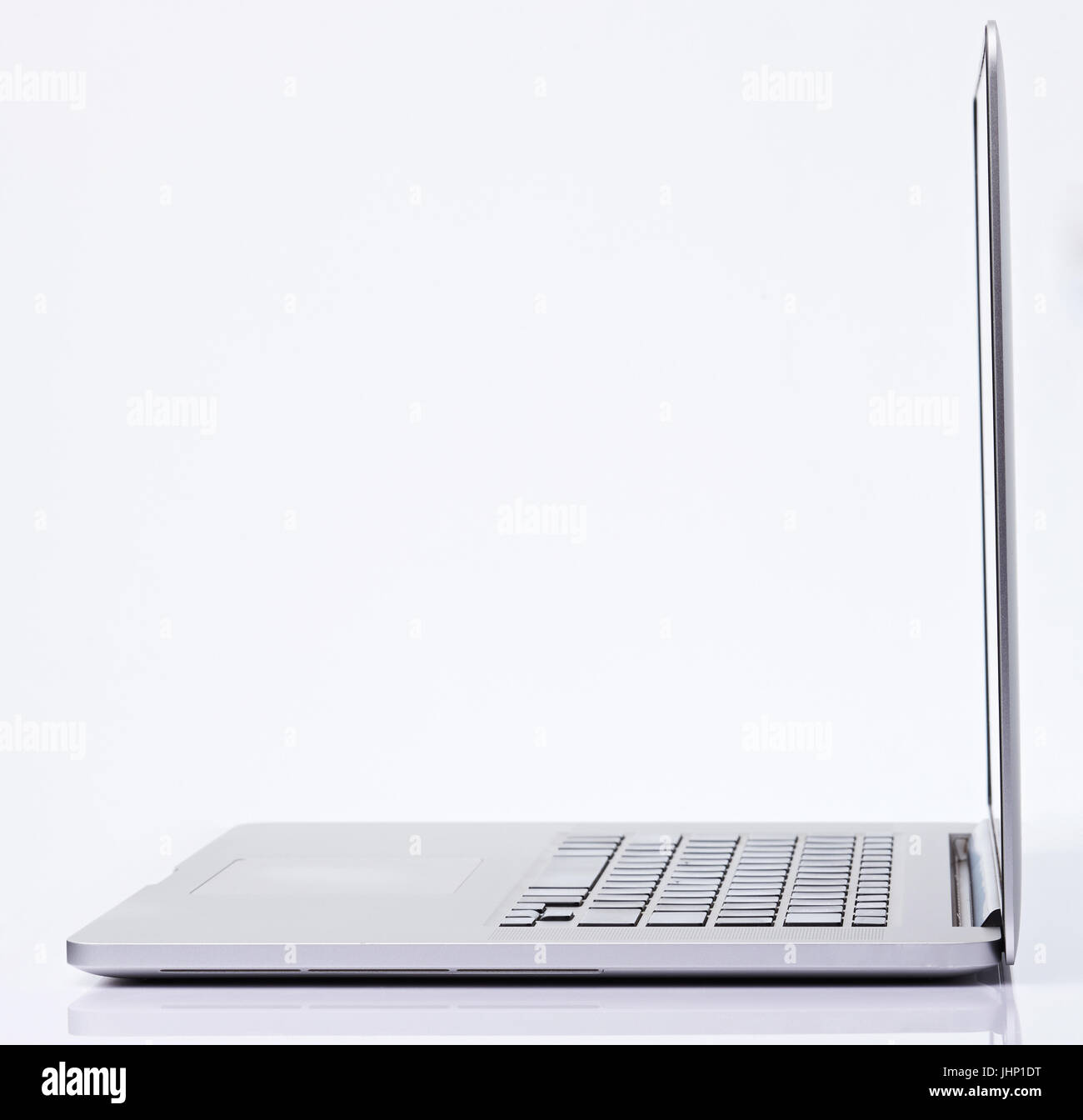 Side view of modern laptop isolated on white background Stock Photo - Alamy