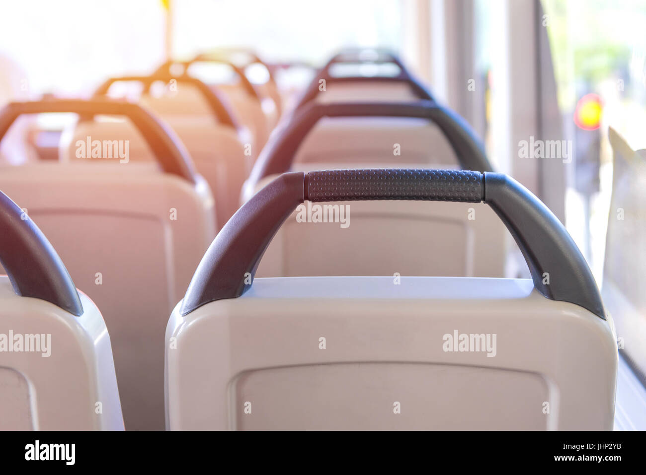 Seat places in back side of modern bus Stock Photo - Alamy