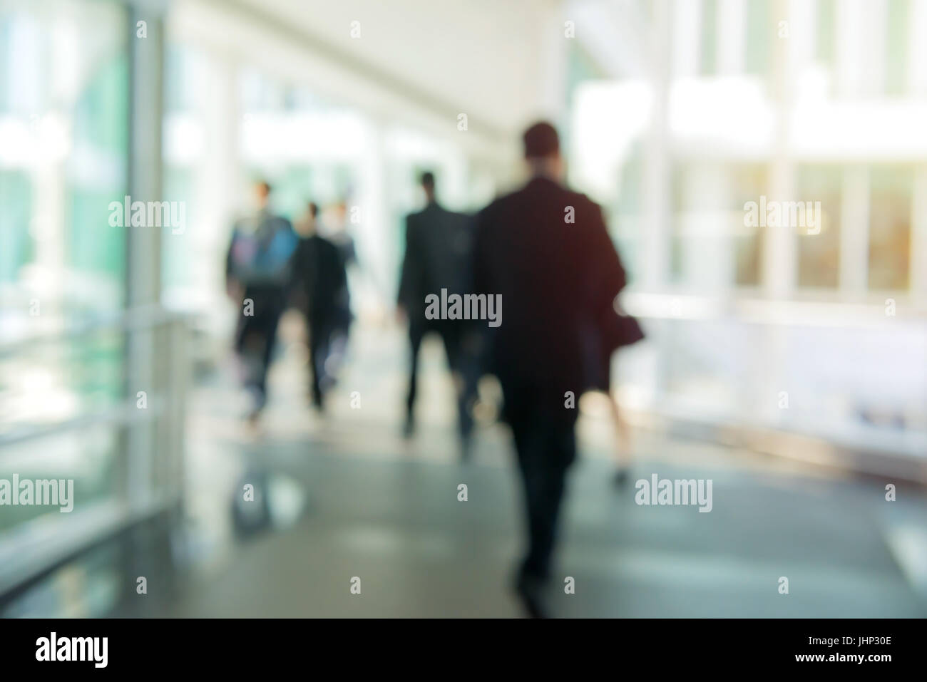 blur People Walking in the corridor of business center Stock Photo - Alamy