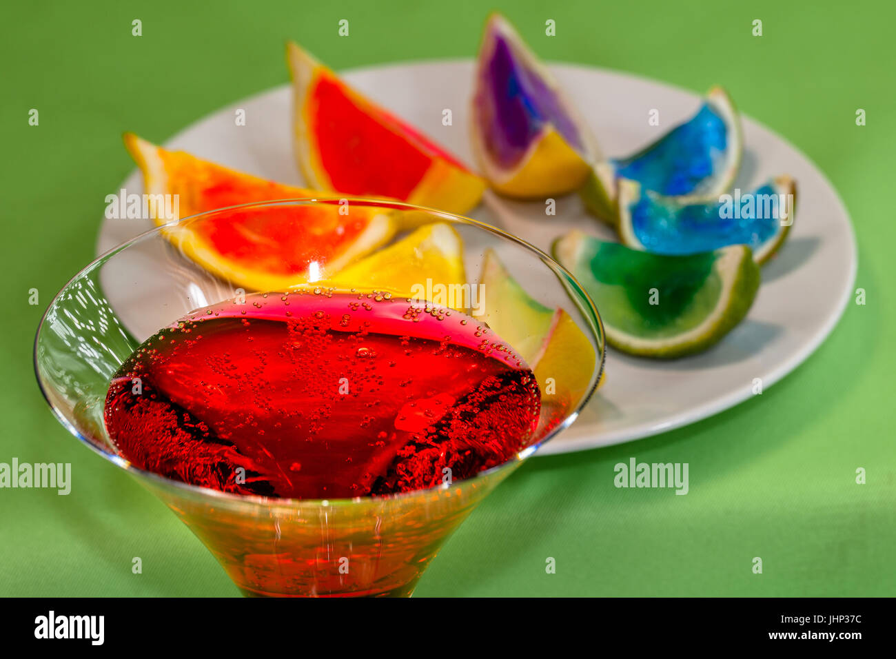 a cup of strawberry with colorful lemon in green background Stock Photo ...
