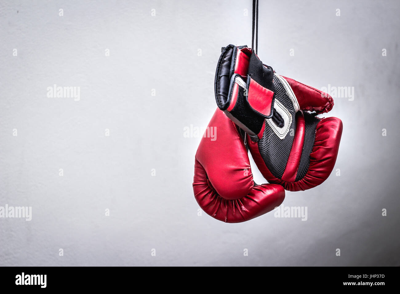 Photograph of a pair of red boxing gloves Stock Photo - Alamy