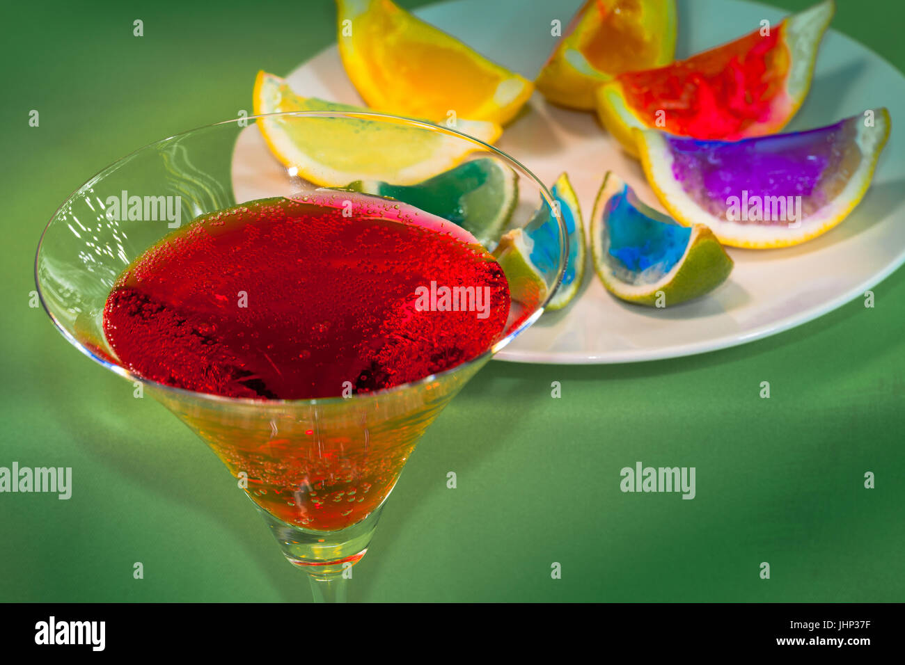 a cup of strawberry with colorful lemon in green background Stock Photo ...