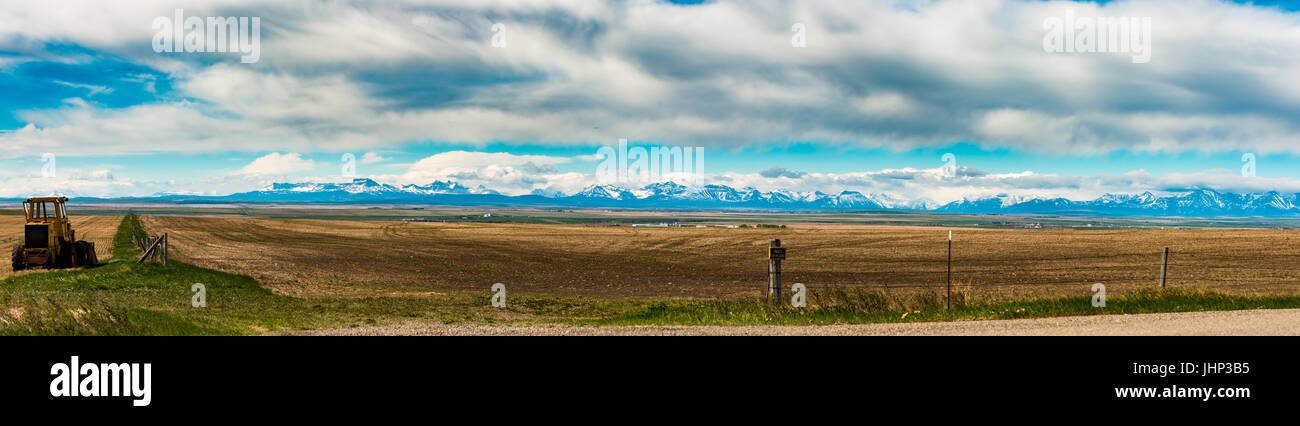 Prairie farmland in the shadow of the Rocky Mountains Alberta Canada ...