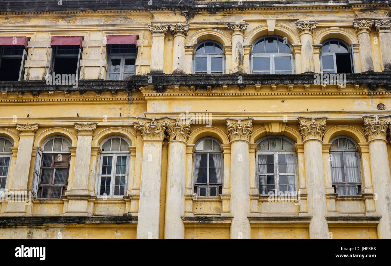 Yangon, Myanmar - Feb 26, 2016. Facade of old British colonial building ...