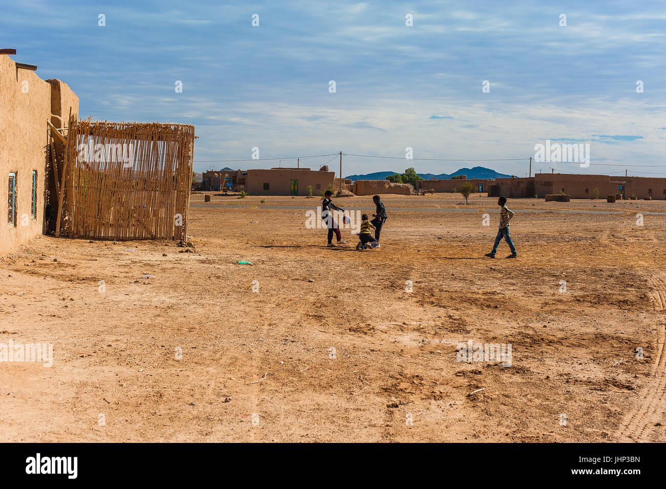 Poor child playing football hi-res stock photography and images - Alamy