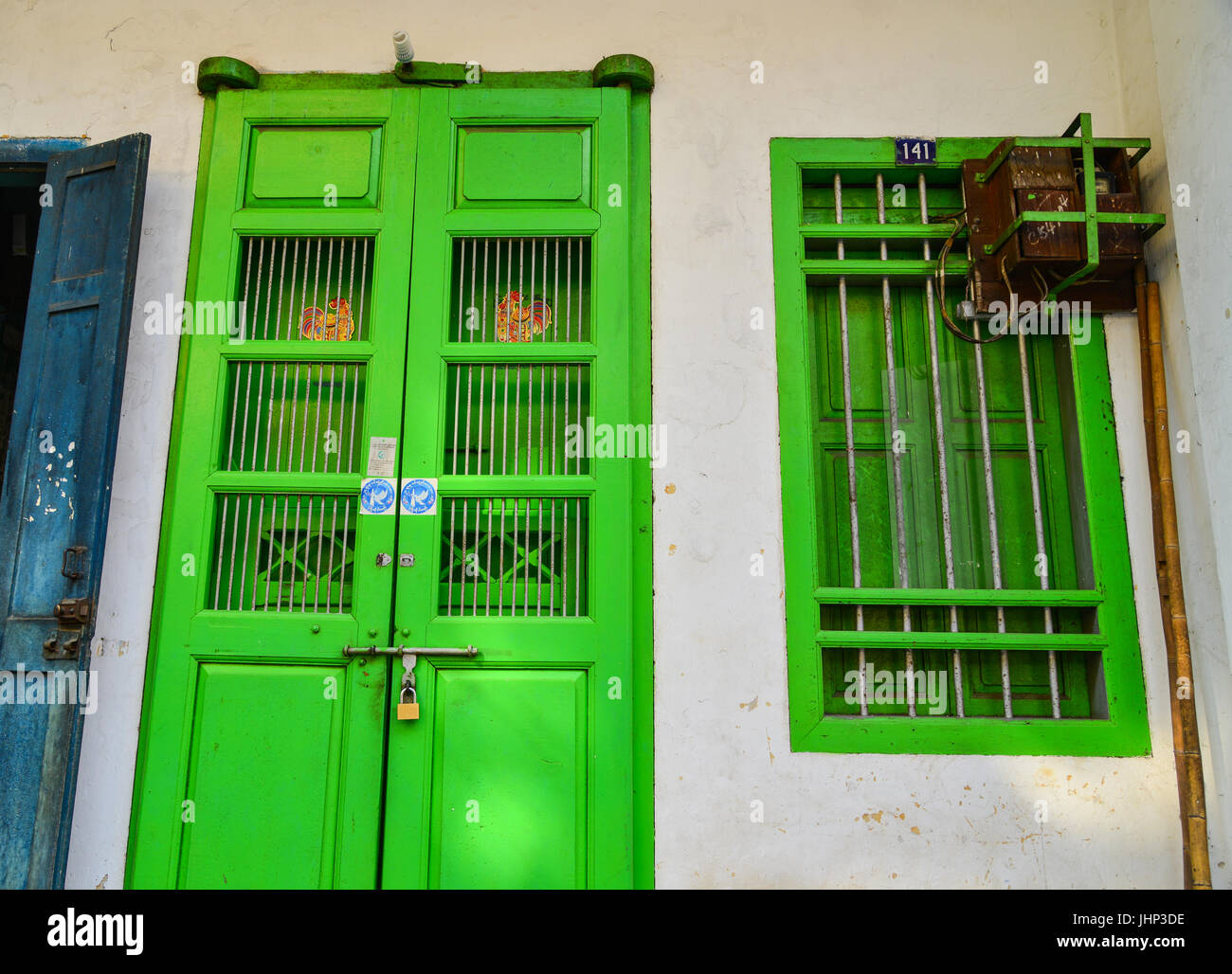 Yangon, Myanmar - Feb 1, 2017. Old buildings with wooden door at ...