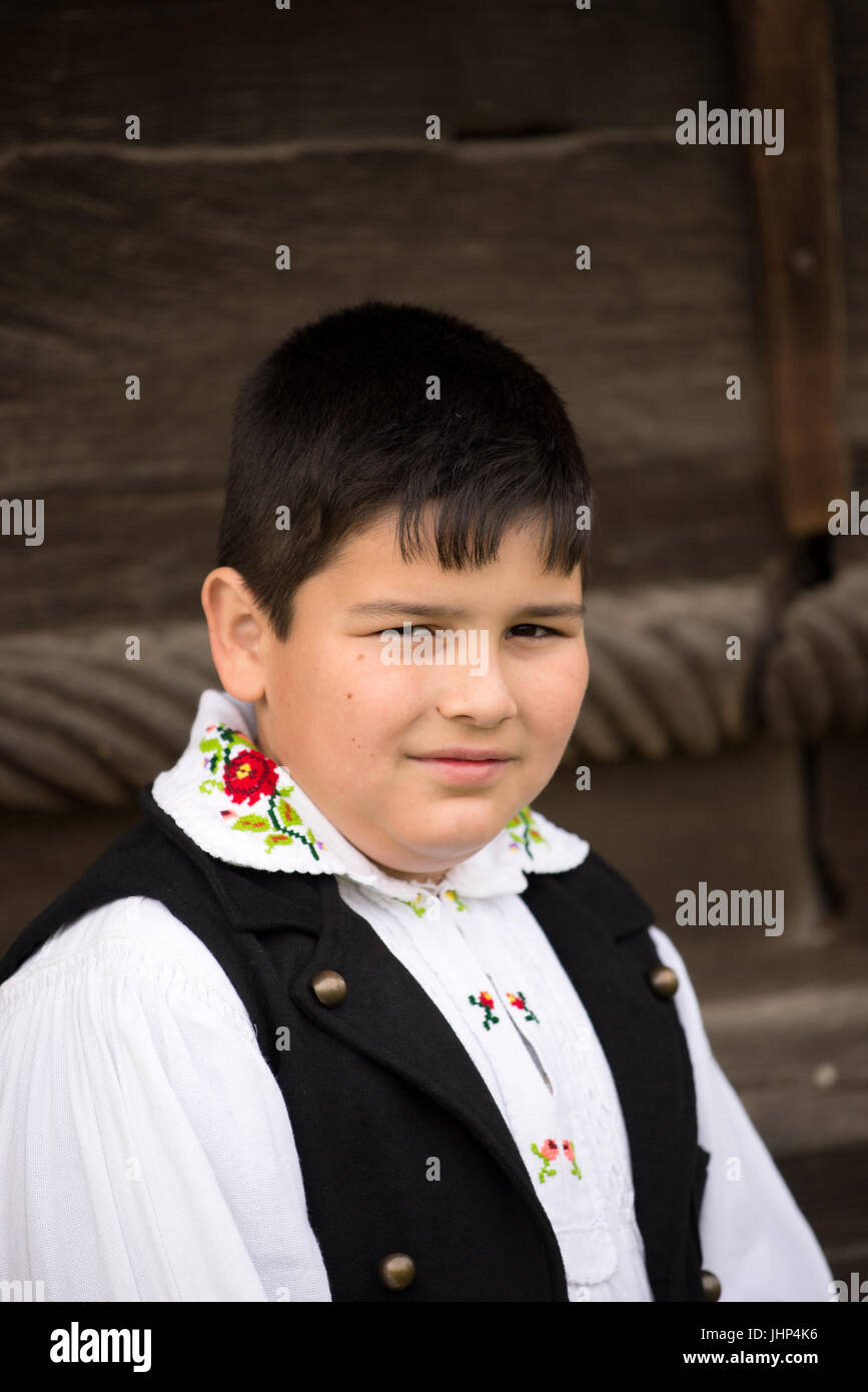 Young boy in traditional costume at "Udatoriul" old agrarian custom on ...