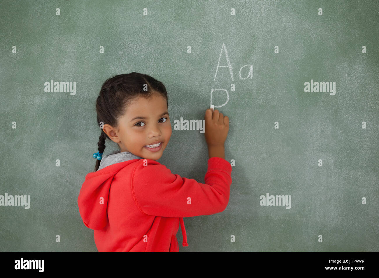 Child writing alphabet board hi-res stock photography and images - Alamy