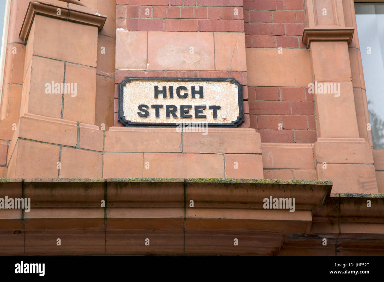 High Street Sign on Red Brick Wall Stock Photo - Alamy
