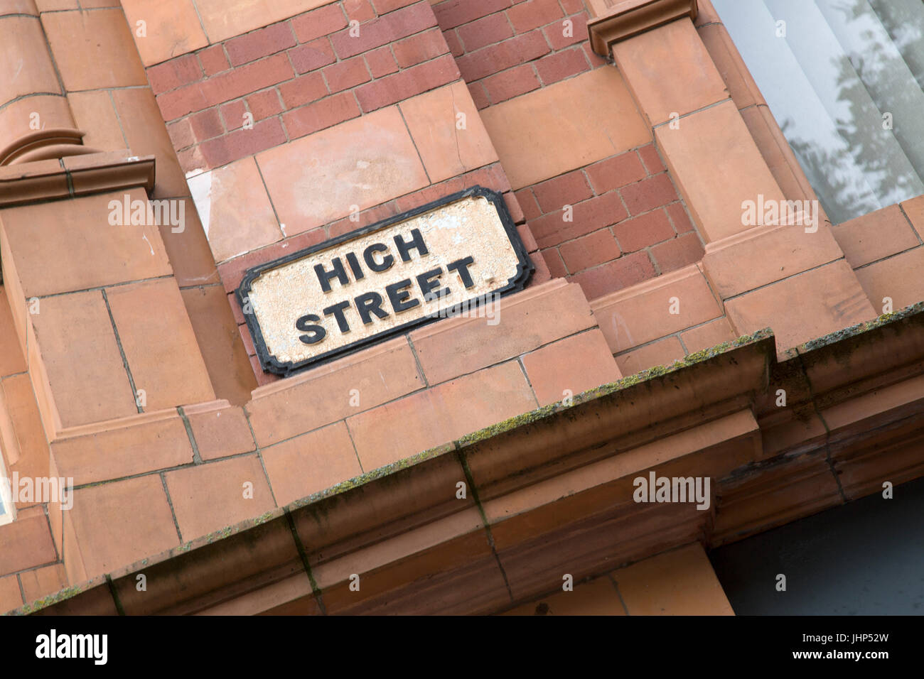 High Street Sign on Red Brick Wall Stock Photo - Alamy
