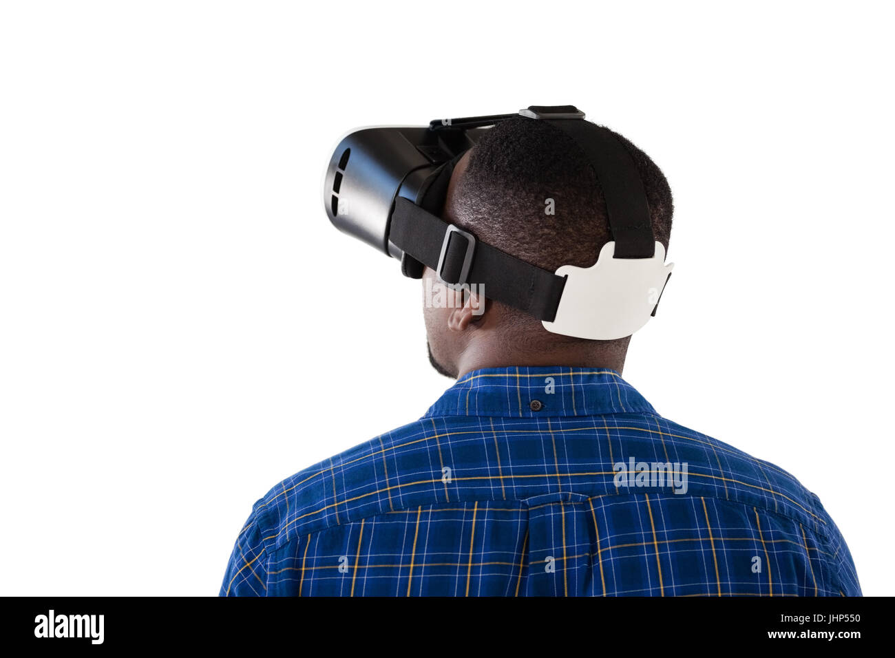 Rear view of man using virtual reality headset against white background ...