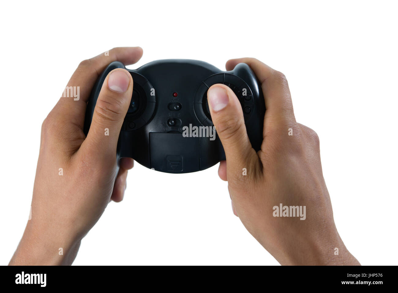 Cropped image of man holding controller against white background Stock ...