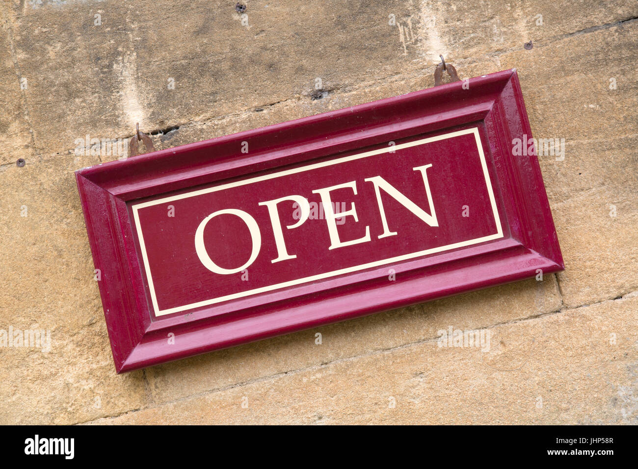 Open Sign against Wall Background Stock Photo - Alamy