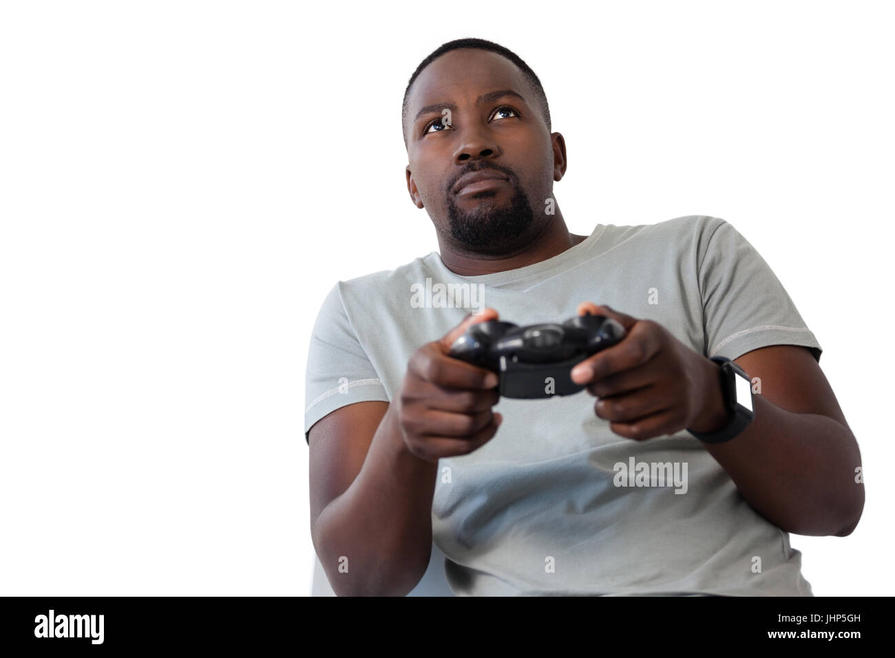 Close-up of man playing video game against white background Stock Photo ...