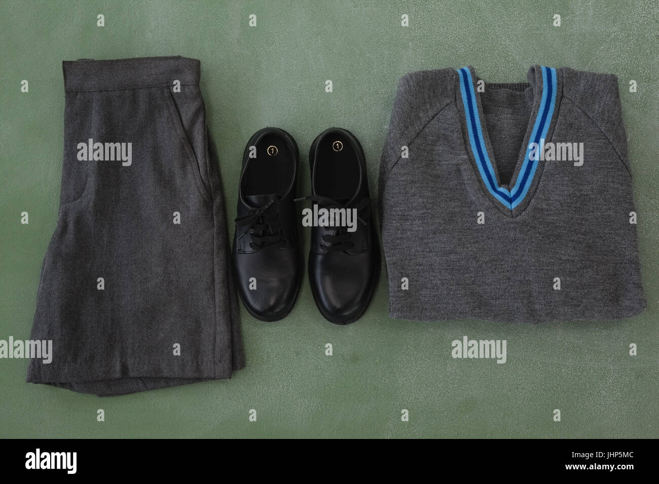 Close-up of school uniform arranged on chalkboard Stock Photo - Alamy