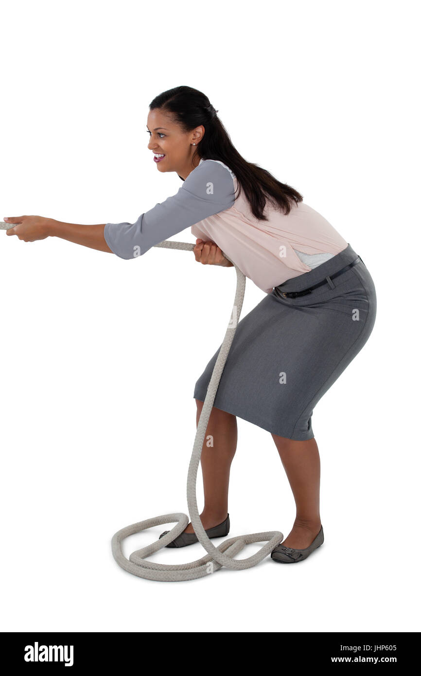 Businesswoman pulling the rope against white background Stock Photo - Alamy